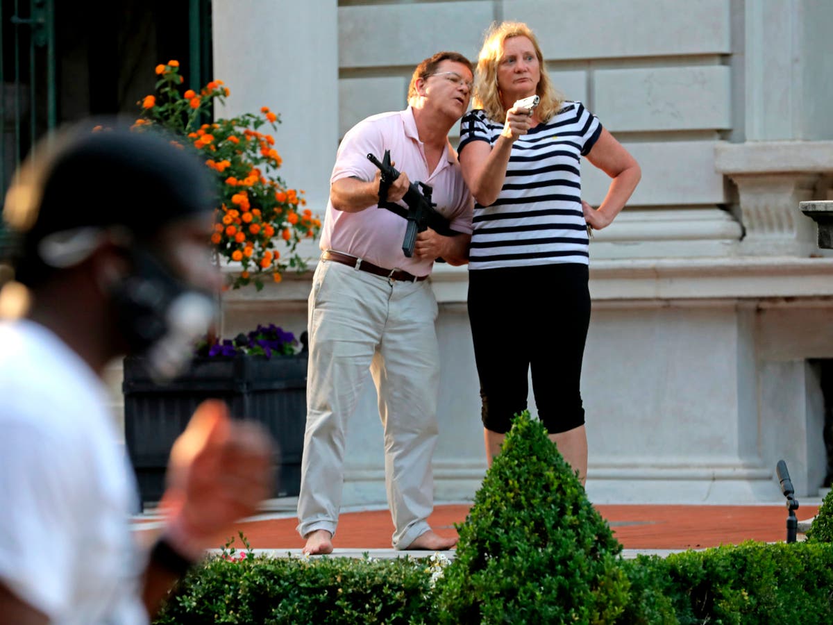Nine protesters confronted by gun-toting couple backed by Trump issued ...