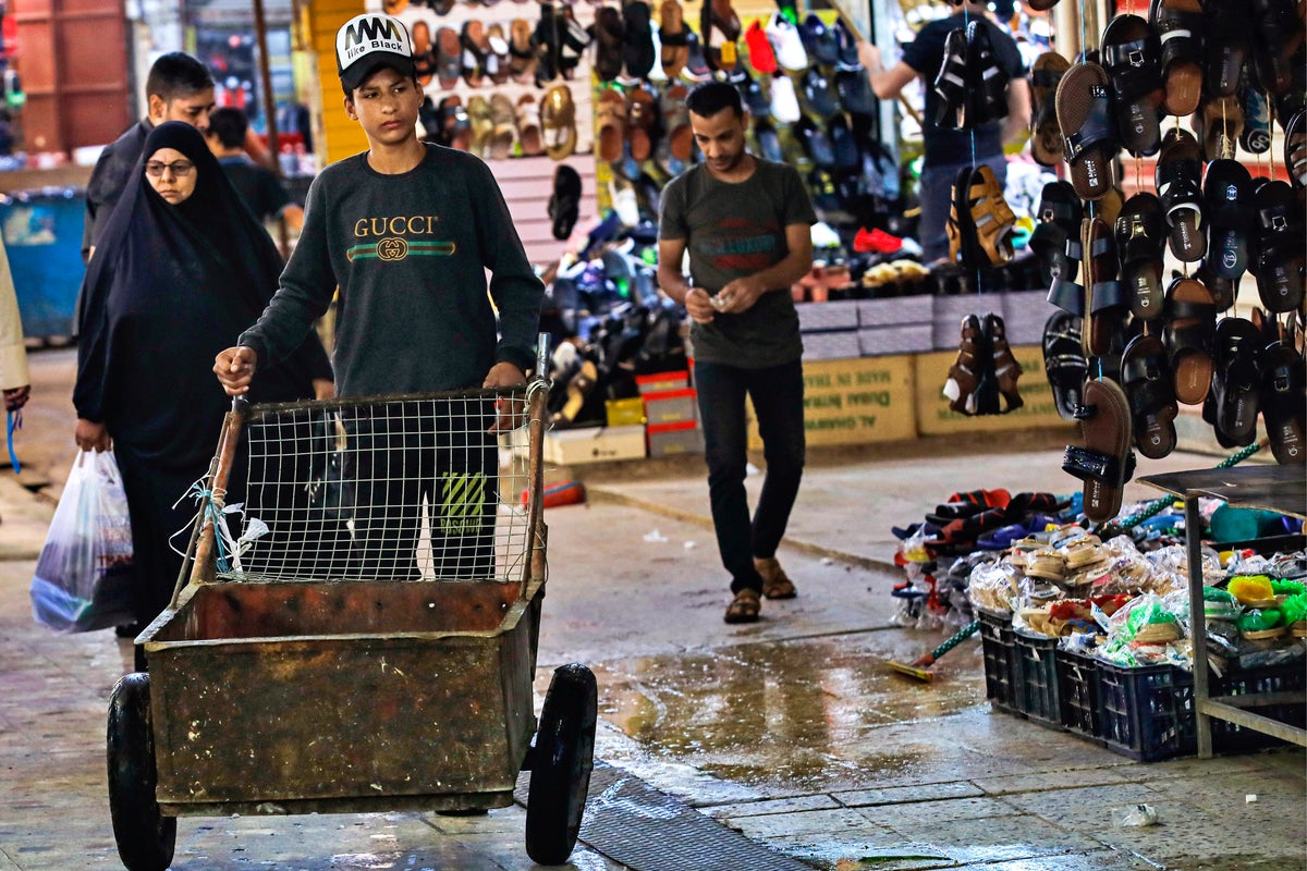 Iraq's central bank devalues dinar by 22% amid public anger central ...