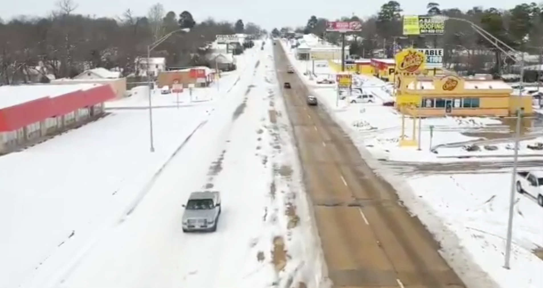Texas winter storm: Stateline road covered in snow on one side and ...