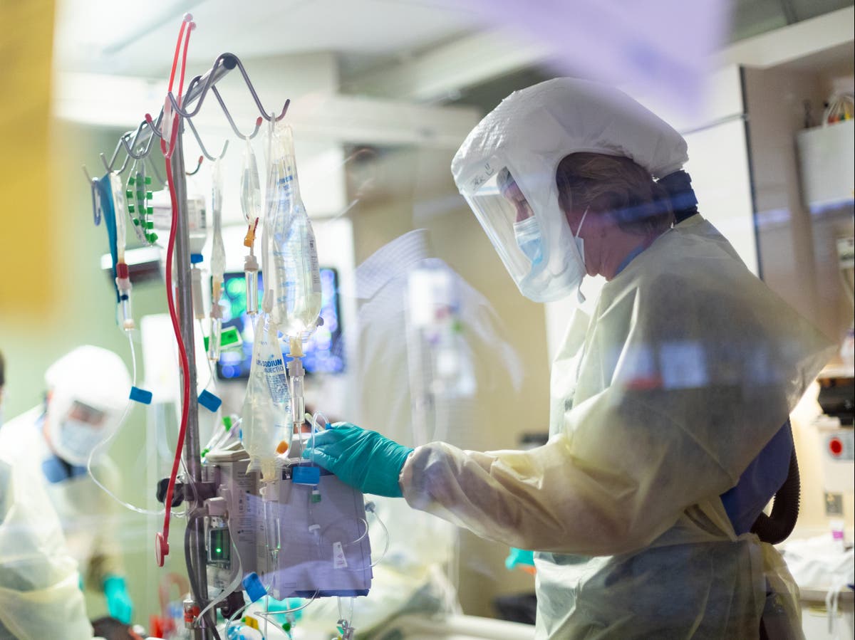 US follows UK’s lead and shortens isolation for healthcare workers who ...