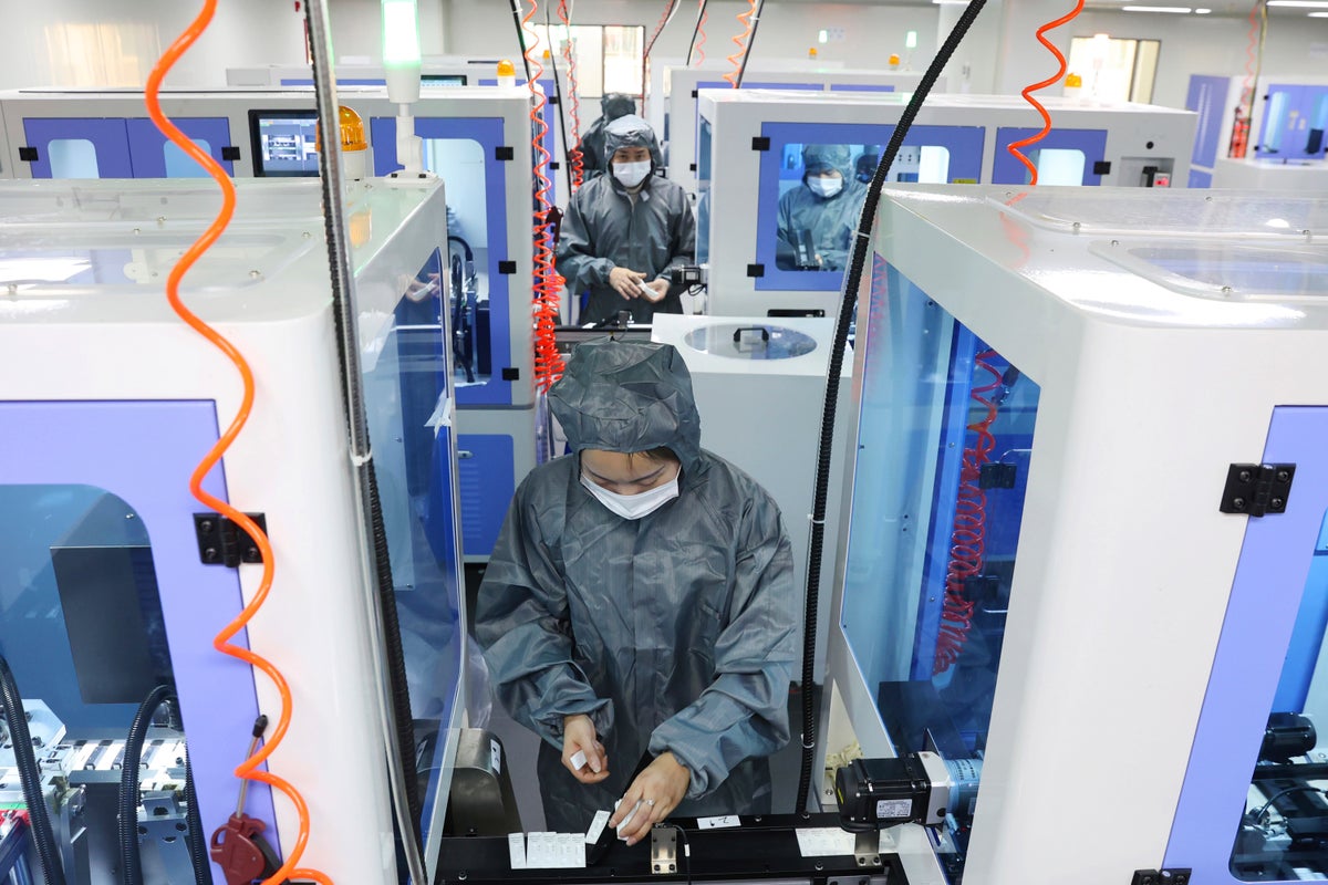 Chinese factory activity edges higher in December | The Independent