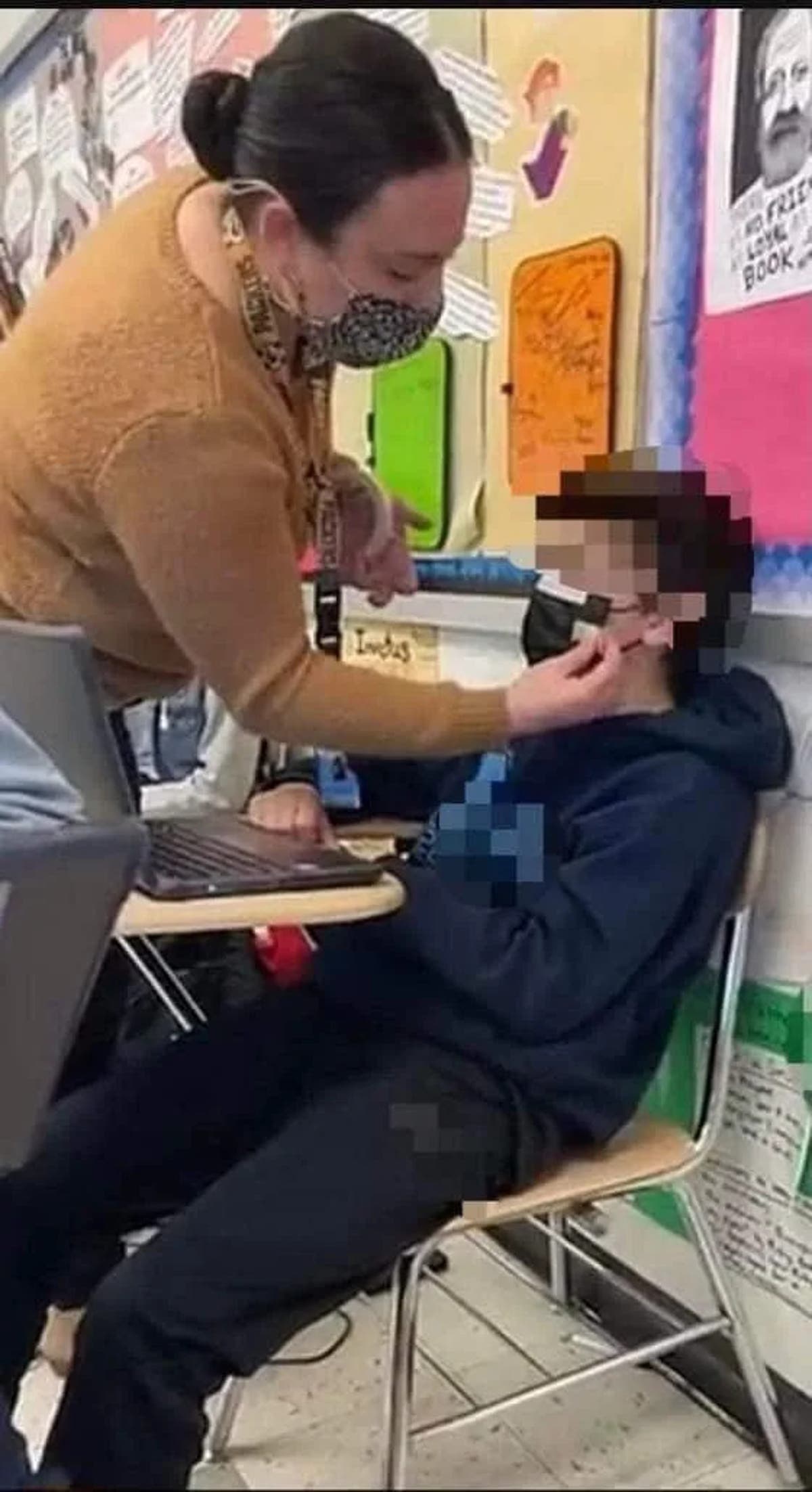 Photo of teacher taping child’s Covid mask to his face sparks debate ...