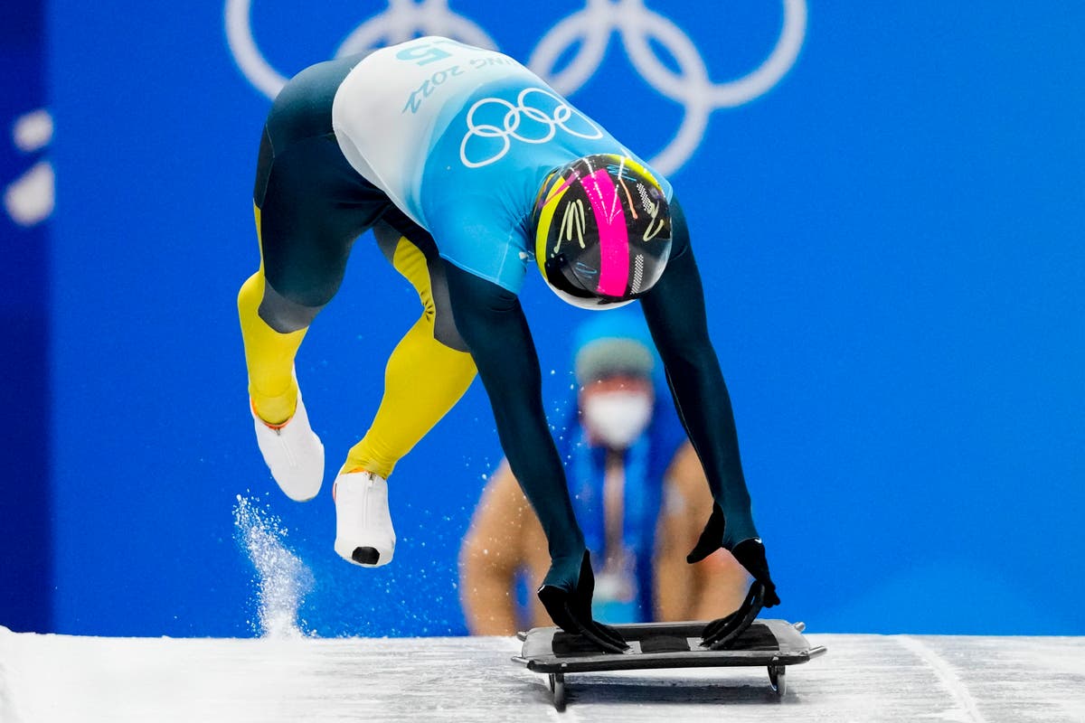 Olympic skeleton athlete from Ukraine displays 'no war' sign | The ...