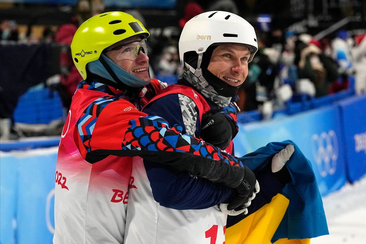 Ukrainian and Russian celebrate with hug at Beijing Olympics | The ...
