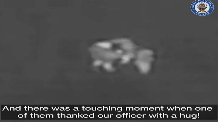 Woman hugs police officer after being saved from swamp by drone | News ...