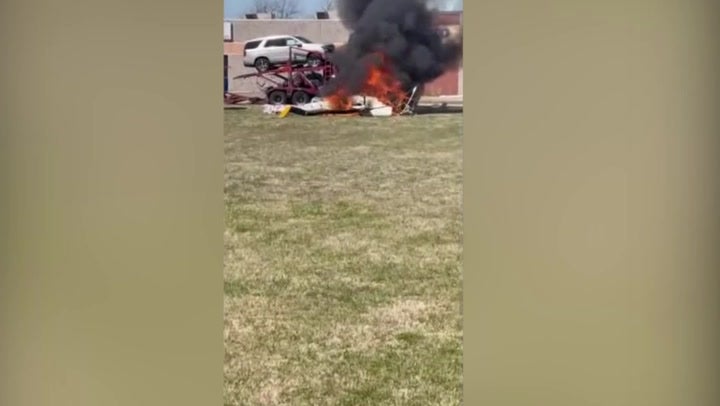 Helicopter falls from the sky before crashing and bursting into flames ...