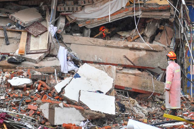China building collapse: Two survivors pulled from rubble more than 50 ...