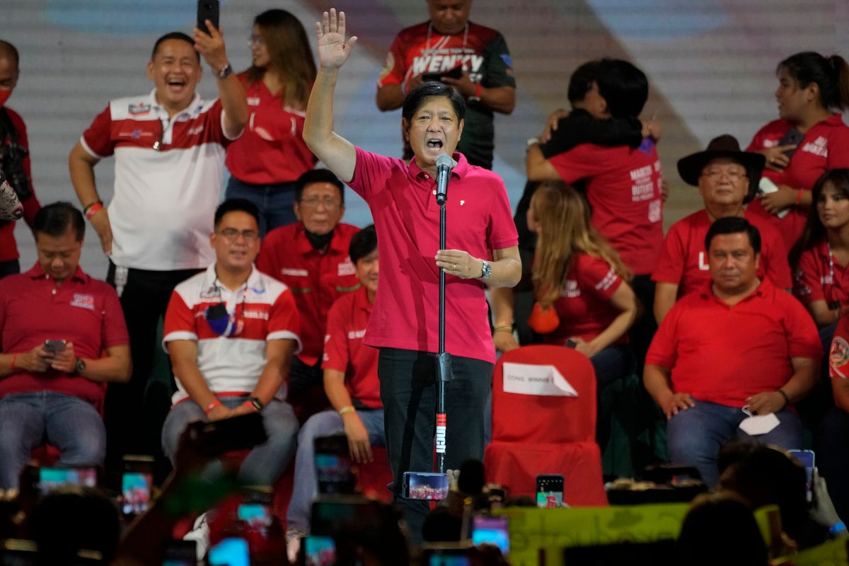 Philippine election narrows to Marcos, rights defender | The Independent