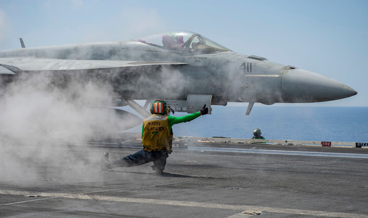 Storm knocks $67m US fighter jet off aircraft carrier into ...