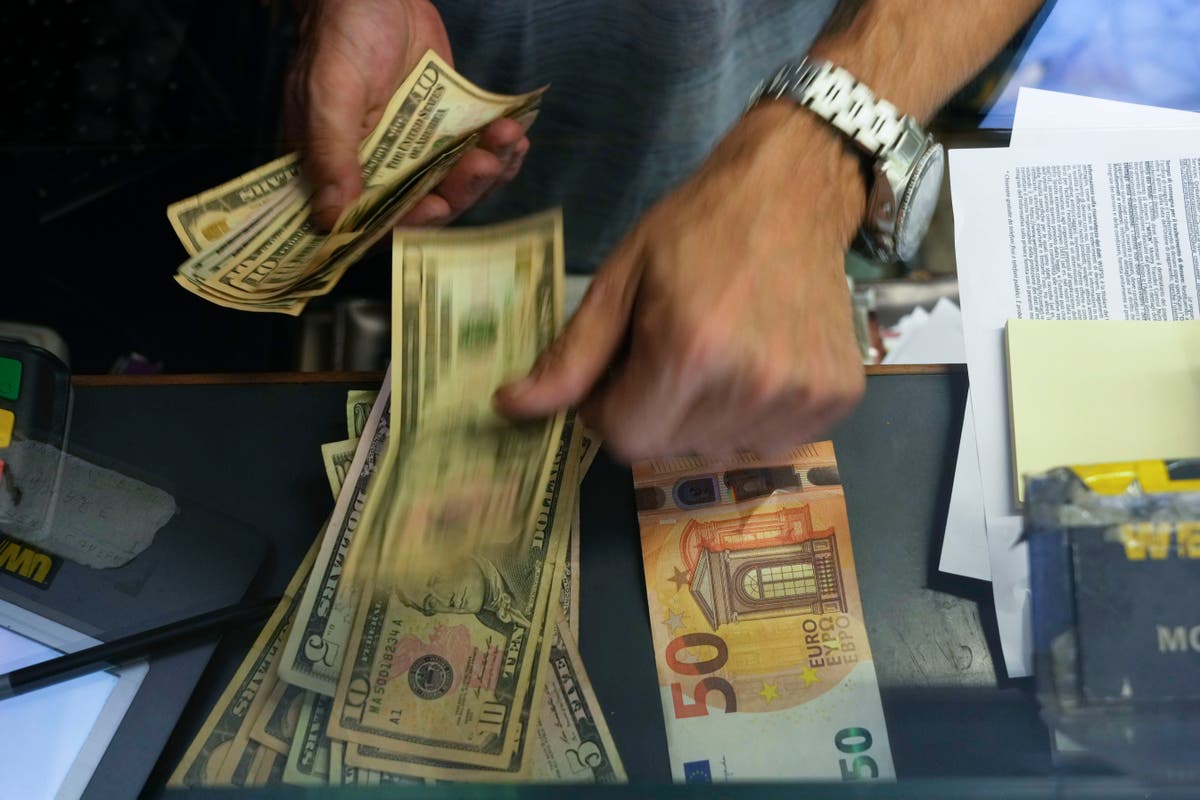 Euro falls below parity with the dollar. What's the impact? | The ...