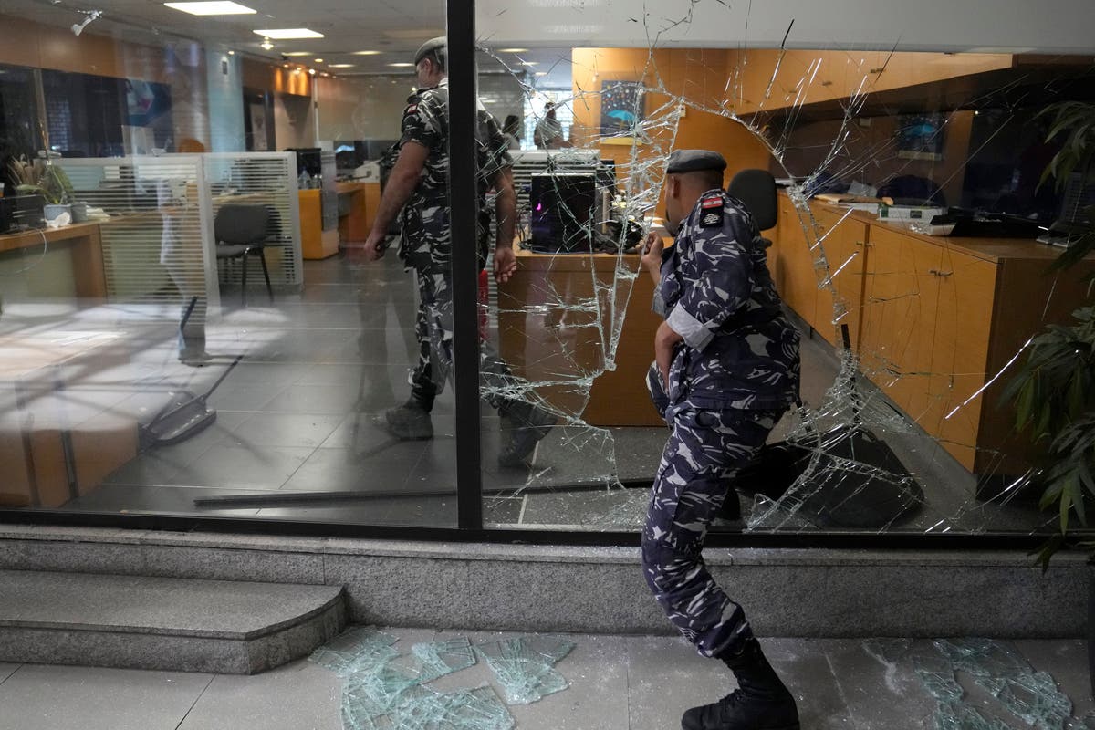 Armed woman breaks into Beirut bank, takes trapped savings | The ...