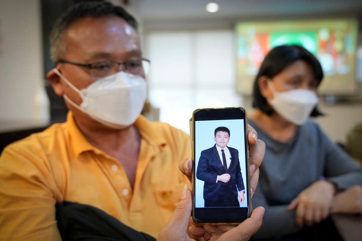 Malaysian dad pleads help for scam victims after son died | The Independent
