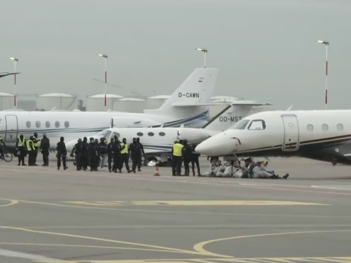 Climate protesters on bikes stop private planes from taking off ahead ...