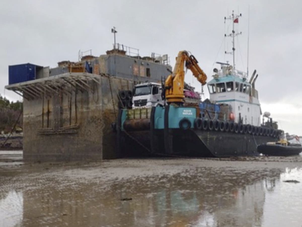 ‘Toxic’ barge that sank more than a year ago is still beached in a ...