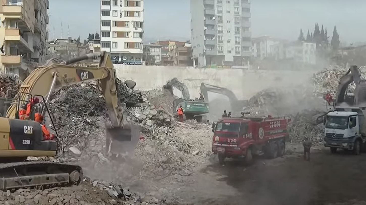 Watch: Crews continue to trawl through earthquake rubble in search of ...