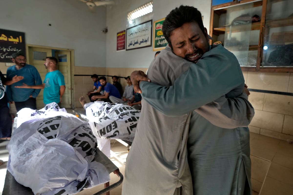 4 firefighters die in garment factory blaze in Pakistan | The Independent