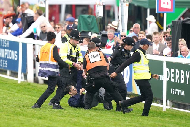 Epsom Derby: Protester arrested after running onto race track | The ...