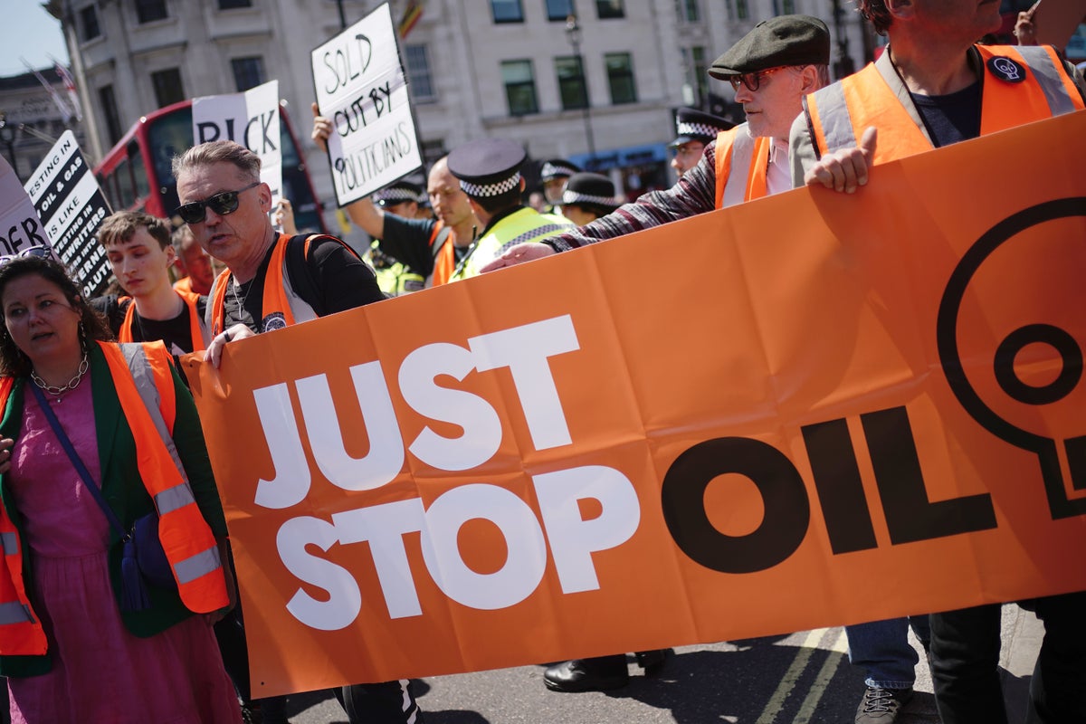 Water thrown onto slow marching Just Stop Oil protesters | The Independent