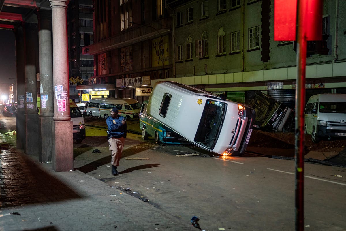 Suspected underground gas explosion rips open roads, flips cars in ...