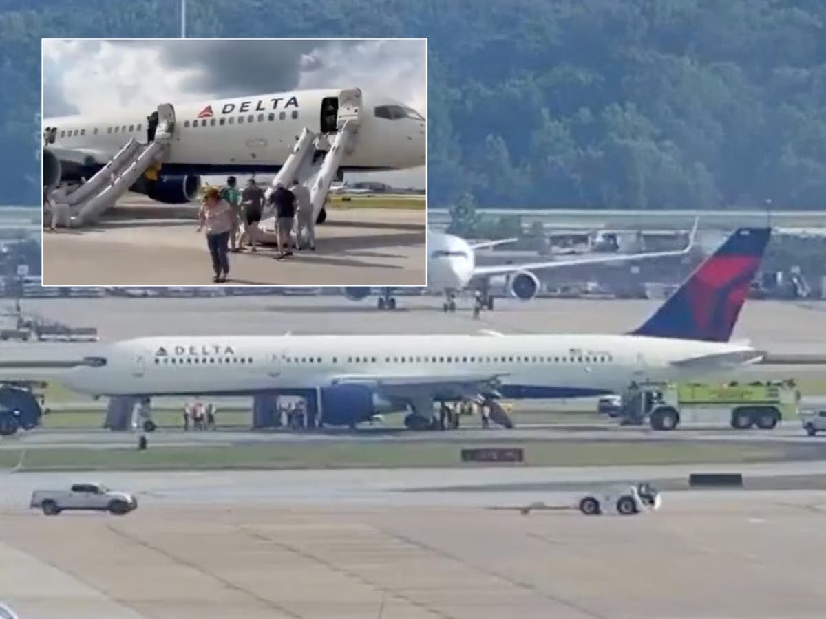 Plane-load of passengers evacuated from Delta flight after tyres burst ...
