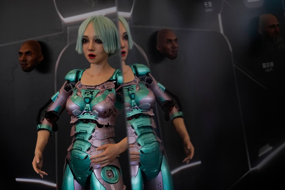 AP PHOTOS: Lifelike robots and android dogs wow visitors at Beijing ...
