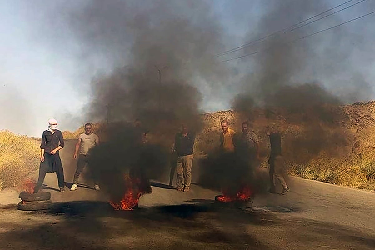 Residents in southern Syria raid ruling party offices, block road as ...
