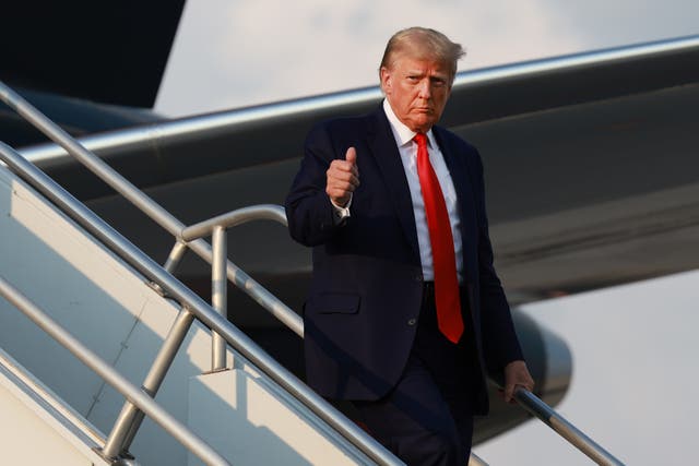 Trump scowls in historic mug shot after arrest at Fulton County Jail ...