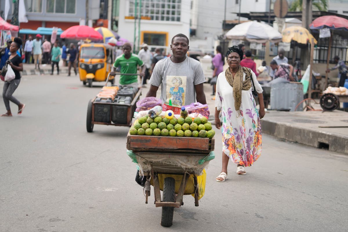 Nigerian workers walk off the job again to protest rising costs after ...