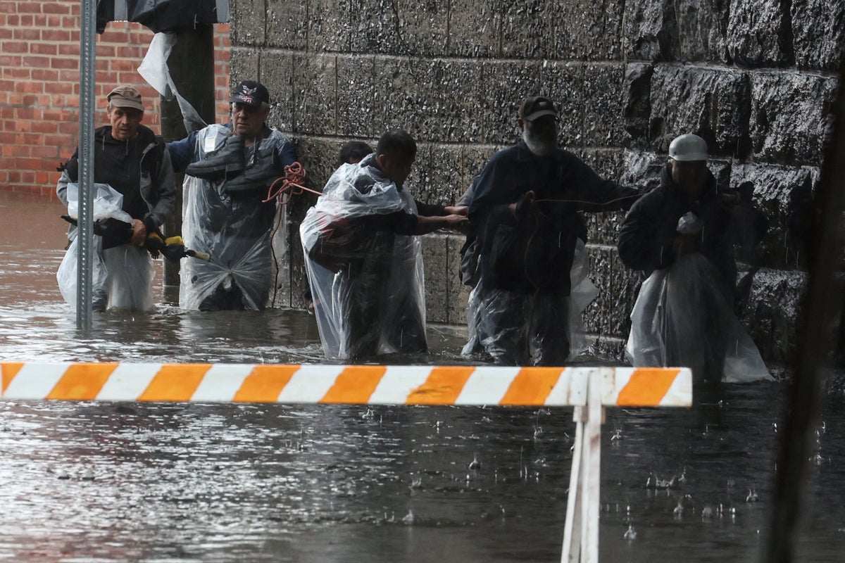 New York engulfed in flooding as subway service buckles and residents ...