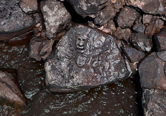 Mysterious ancient ‘human face’ rock carvings revealed by receding ...