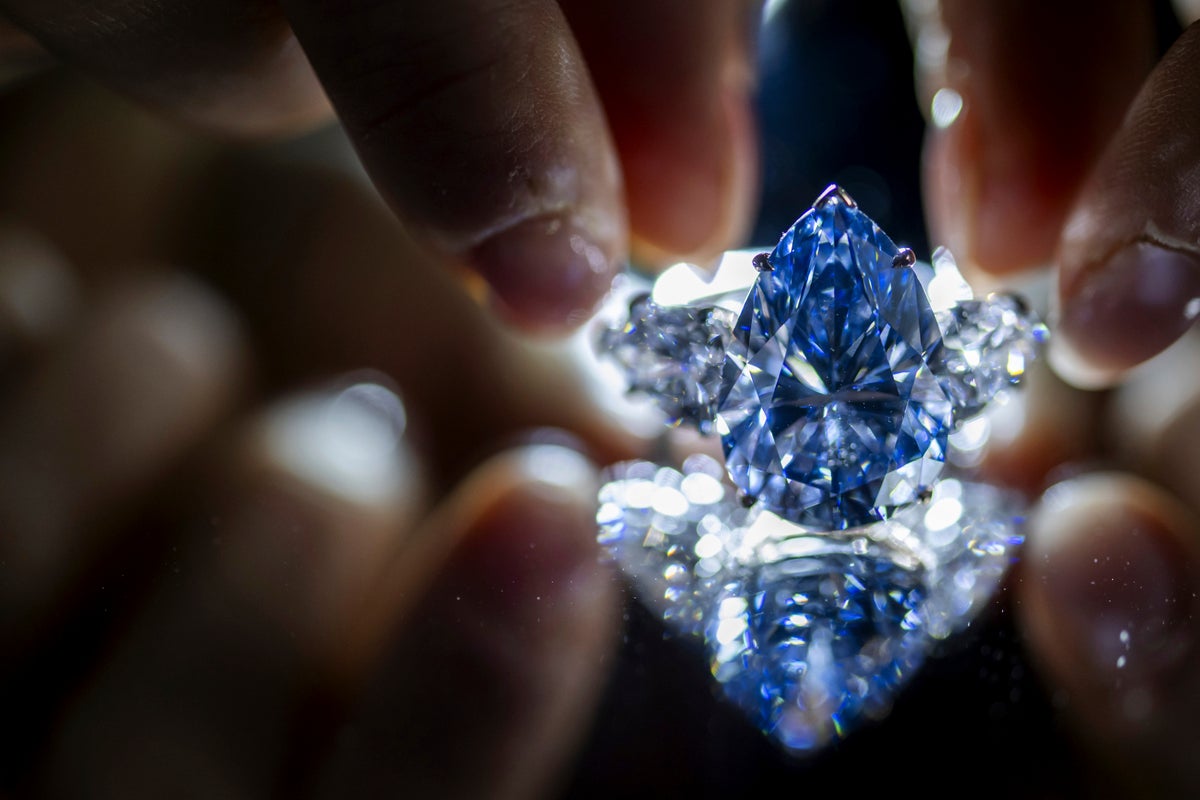 Blue diamond sells for more than $44 million at Christie's auction in ...