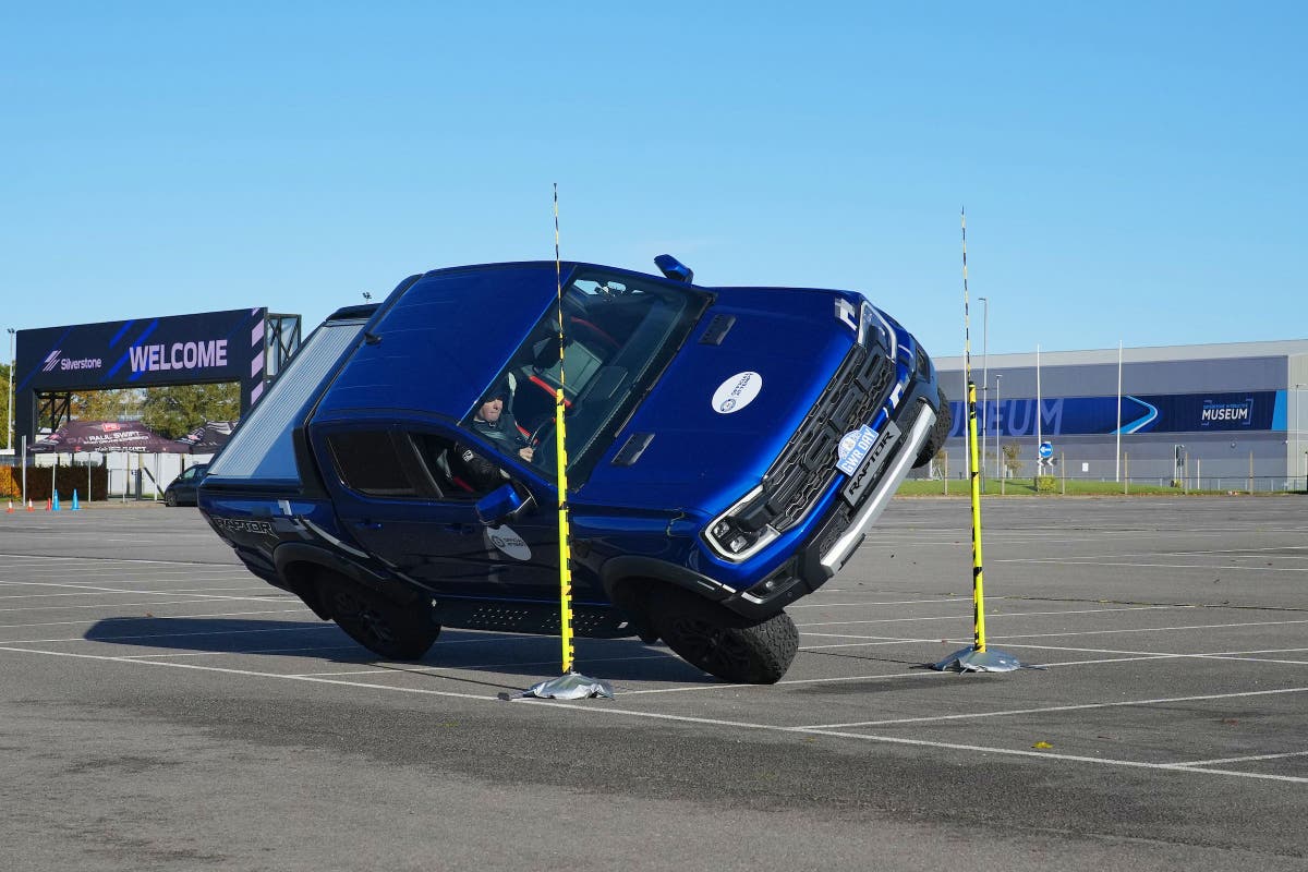 Stunt driver breaks record driving pick-up truck on two wheels through ...