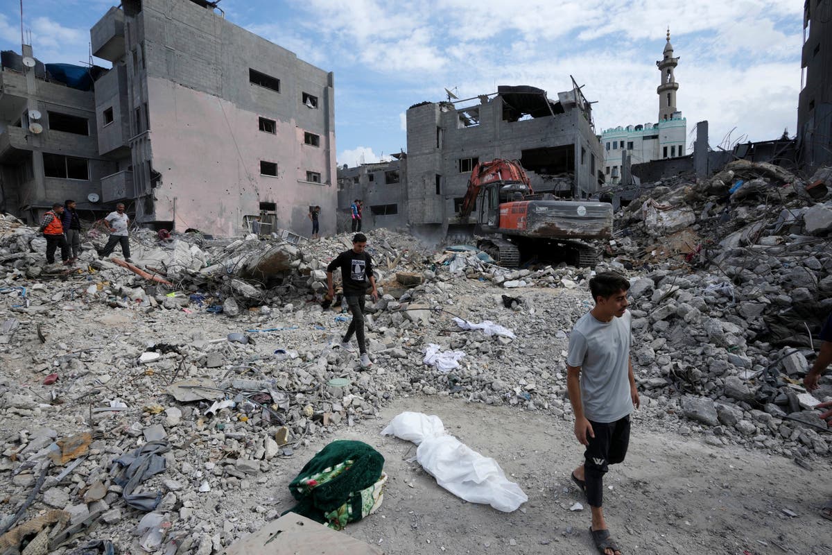 Thousands of bodies lie buried in rubble in Gaza. Families dig to ...