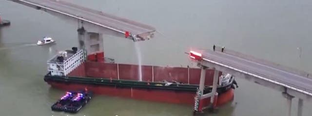 Two dead as ship slams into Chinese road bridge, sending cars flying ...