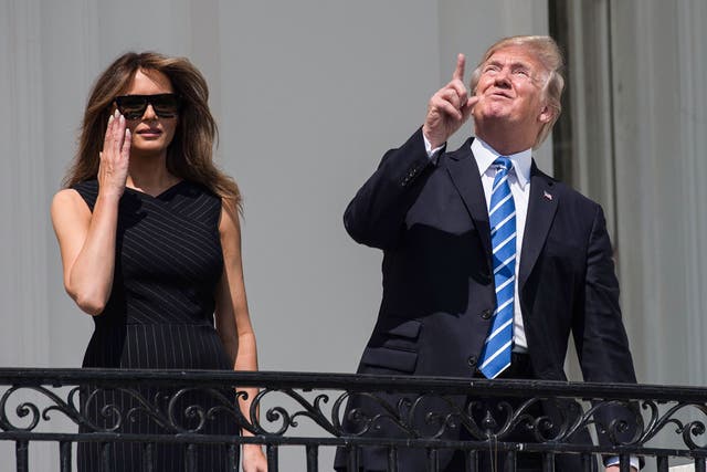 Trump posts bizarre solar eclipse ad – with his head blocking out the ...