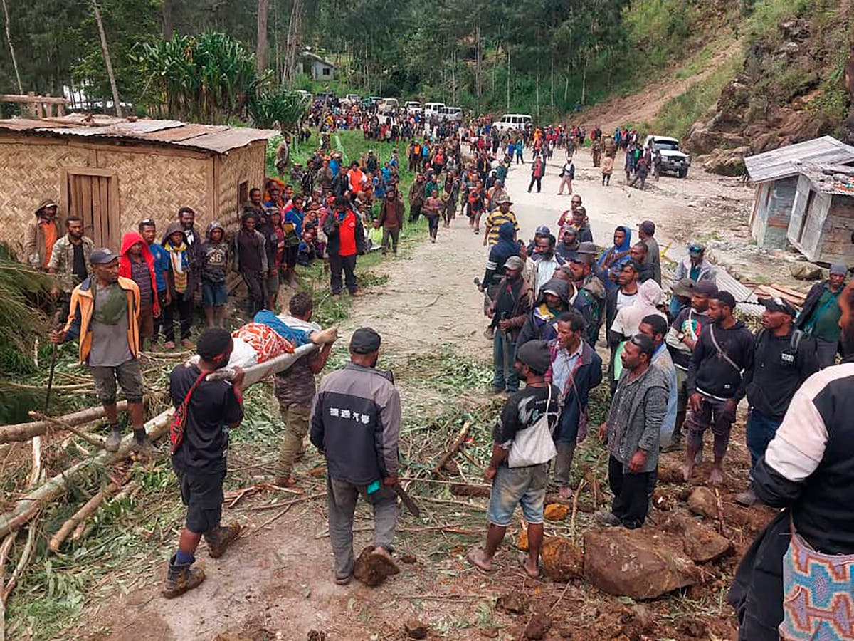 Emergency crews in Papua New Guinea move survivors of massive landslide ...