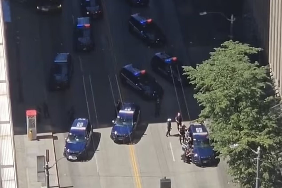 Woman with gun arrested after armed standoff at FBI officers in Seattle ...