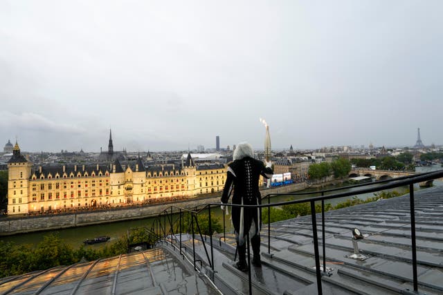 Who were the masked torchbearer and horse rider at the Olympics opening ...