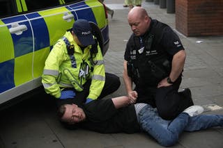 Far-right protesters in violent clashes with police across the UK as ...