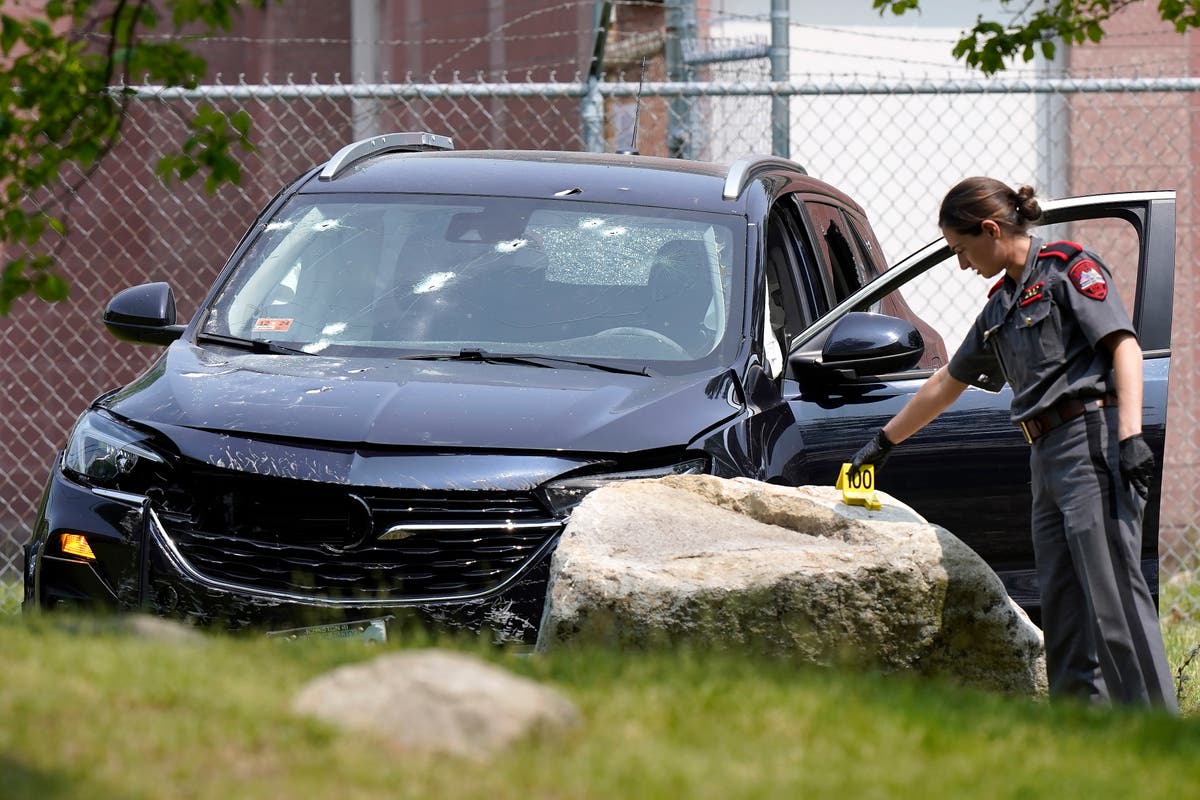 Report clears nearly a dozen officers involved in fatal shooting of ...