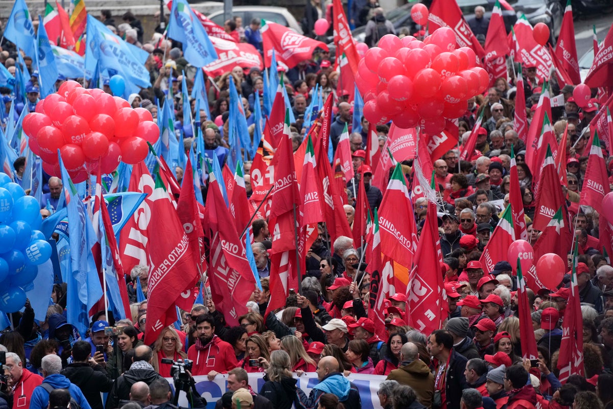 Thousands of workers march across Italy in general strike demanding ...