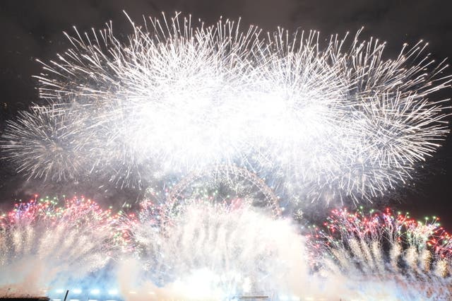 Revellers cheer in New Year around world despite bad weather forcing ...