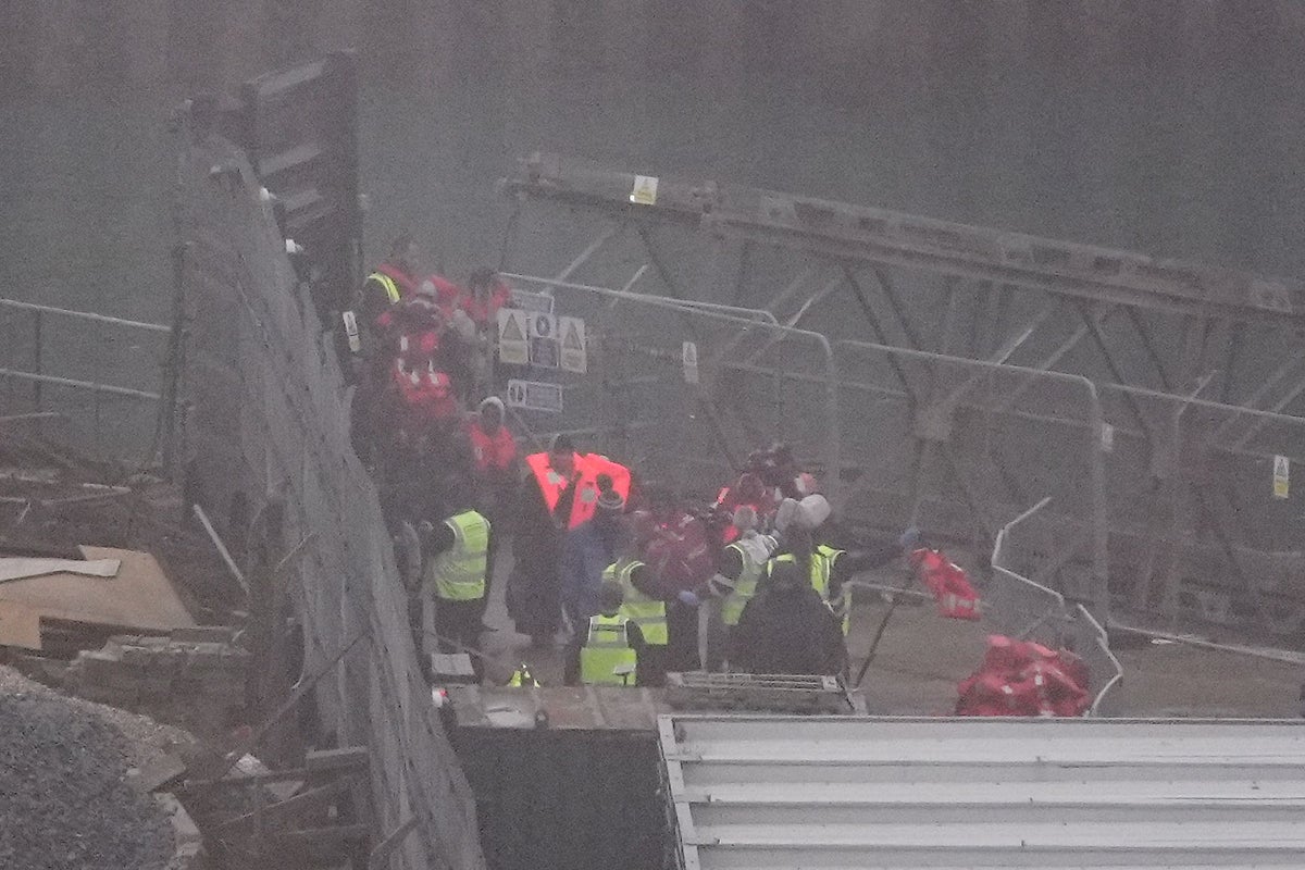 Migrants arrive in UK after crossing English Channel in misty ...
