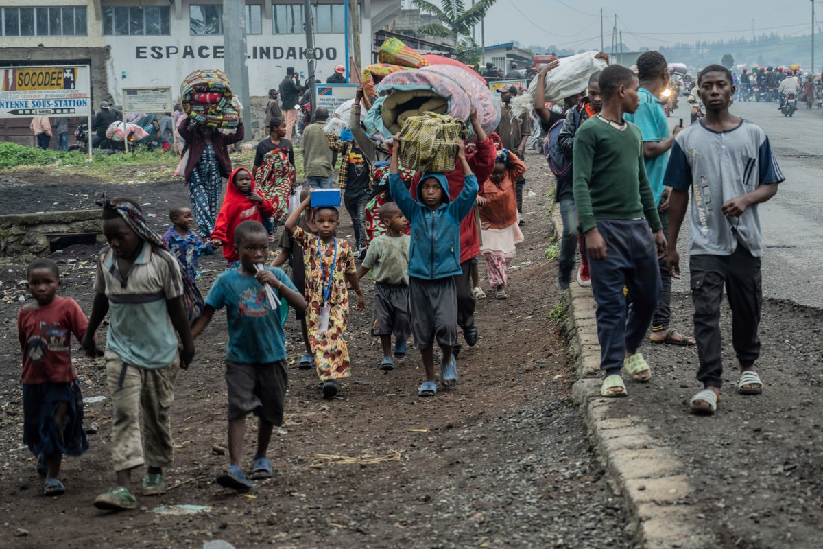 AP PHOTOS: Thousands flee fighting in Congo as rebels claim they've ...