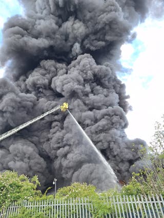 Major incident declared as firefighters battle huge warehouse blaze in ...