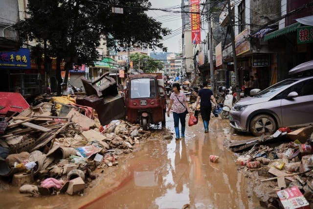 Thousands evacuated in southern China as heavy rains turn streets into ...