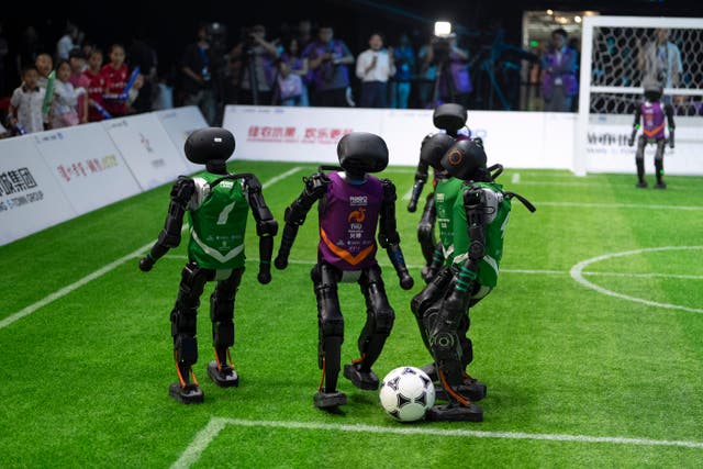 Two robots stretchered off in world’s first AI football match in China ...