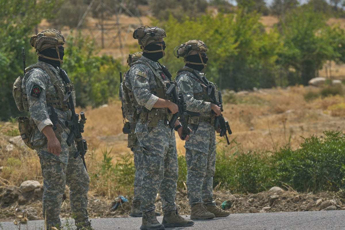 Kurdish separatist fighters in Iraq begin laying down weapons as part ...