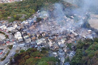 One killed and at least 170 homes damaged as huge fire tears through ...