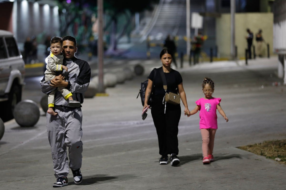 Photos show residents evacuating after explosions in Caracas, Venezuela ...
